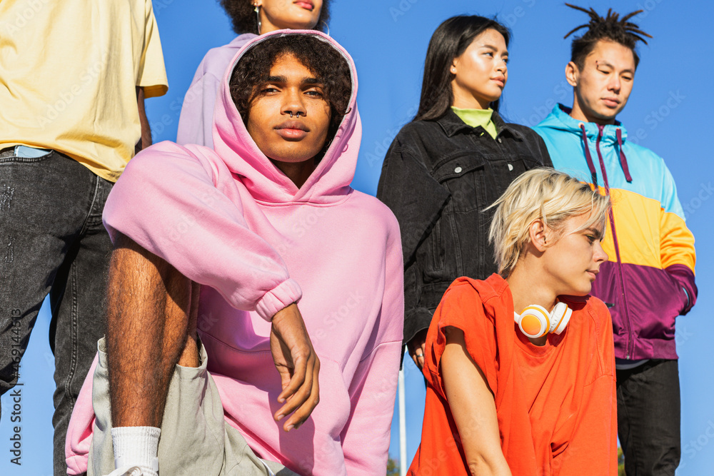 Multiracial group of young friends bonding outdoors Stock Photo | Adobe ...