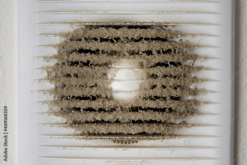 Very dirty and dusty white plastic ventilation grill. Ventilation shaft ...