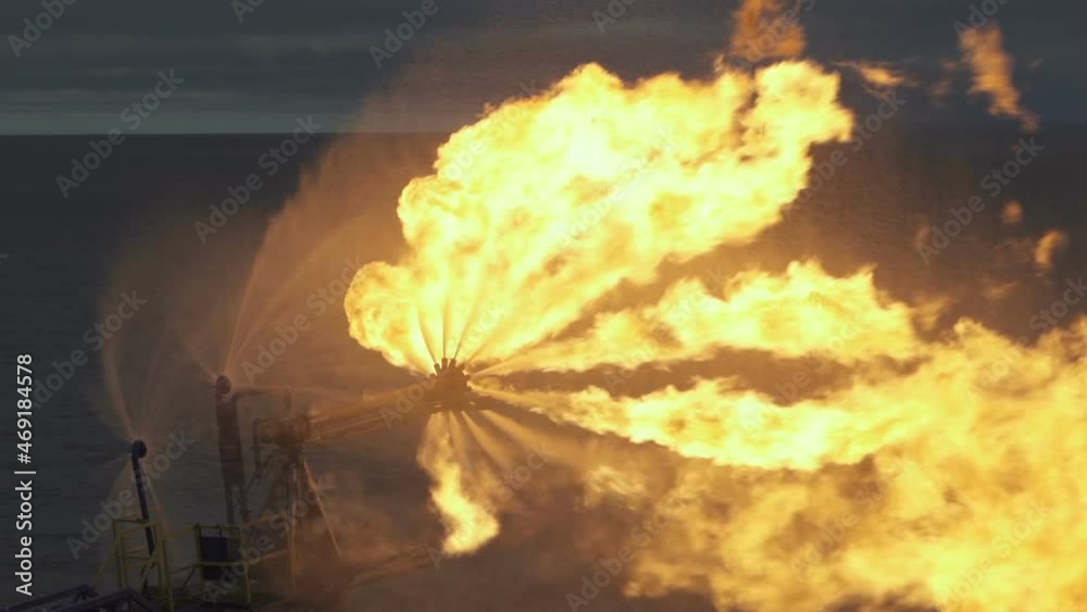 Fire. Yellow-brown flame. Torch is lit. Annealing of associated gas ...
