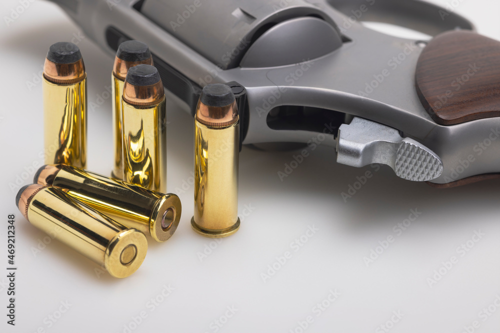 .44 magnum bullets with revolver hand gun background Stock Photo ...