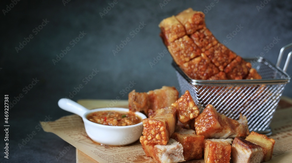 crispy pork belly in a basket with spicy sauce Stock Photo | Adobe Stock