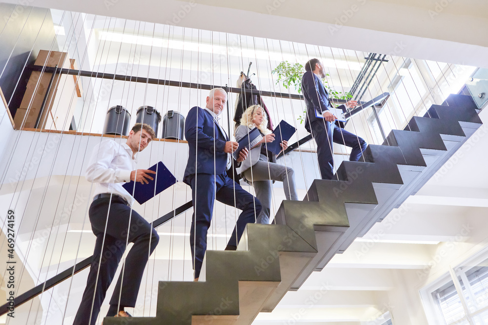 Business consulting team in the stairwell of a company Stock Photo ...