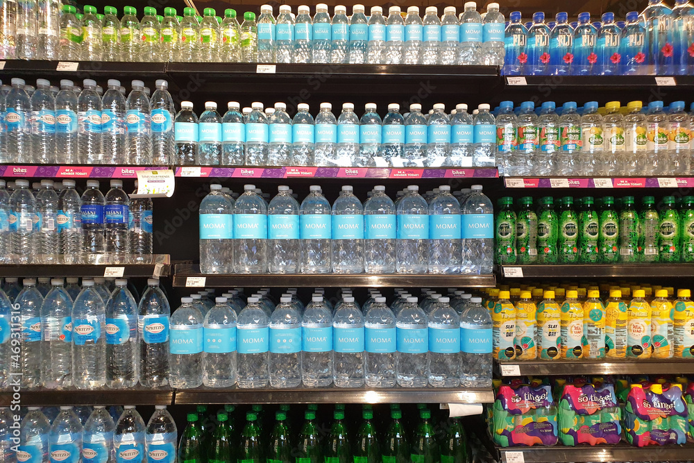 Various choices of bottle drinking water display on store shelf in ...