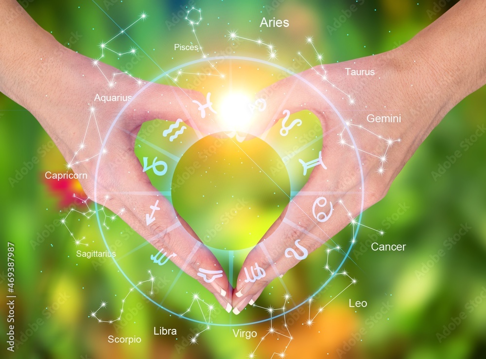 The hands are the heart shape with the sun light passing through the ...