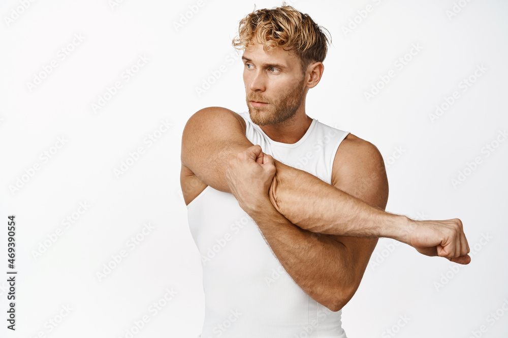 Image of male athlete doing sports, stretching arms warm up, workout in ...