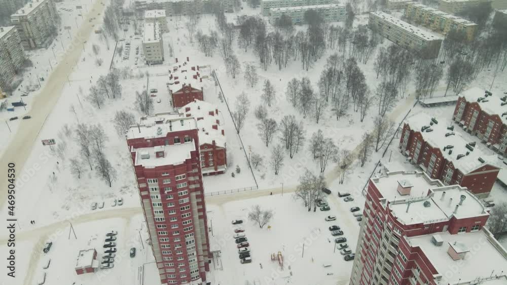 Modern high-rise buildings covered with snow after a blizzard. Aerial ...
