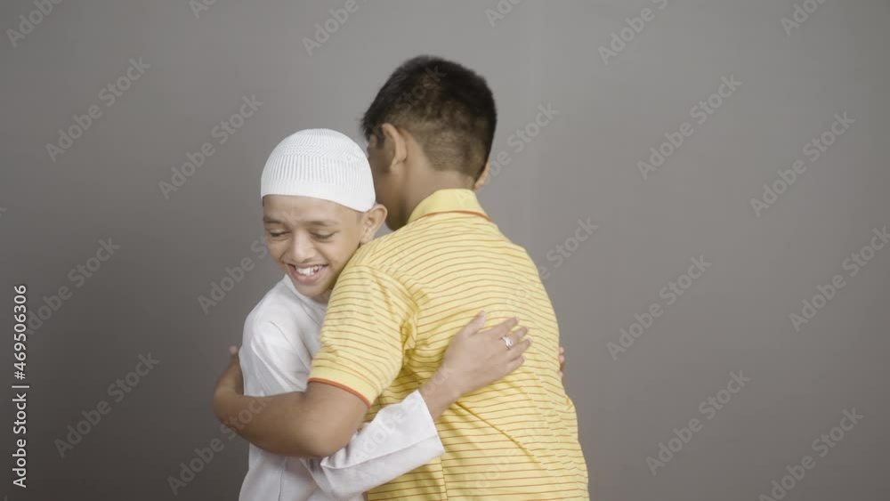 Happy Hindu Muslim Children embracing by Hugging Each Other and looking ...