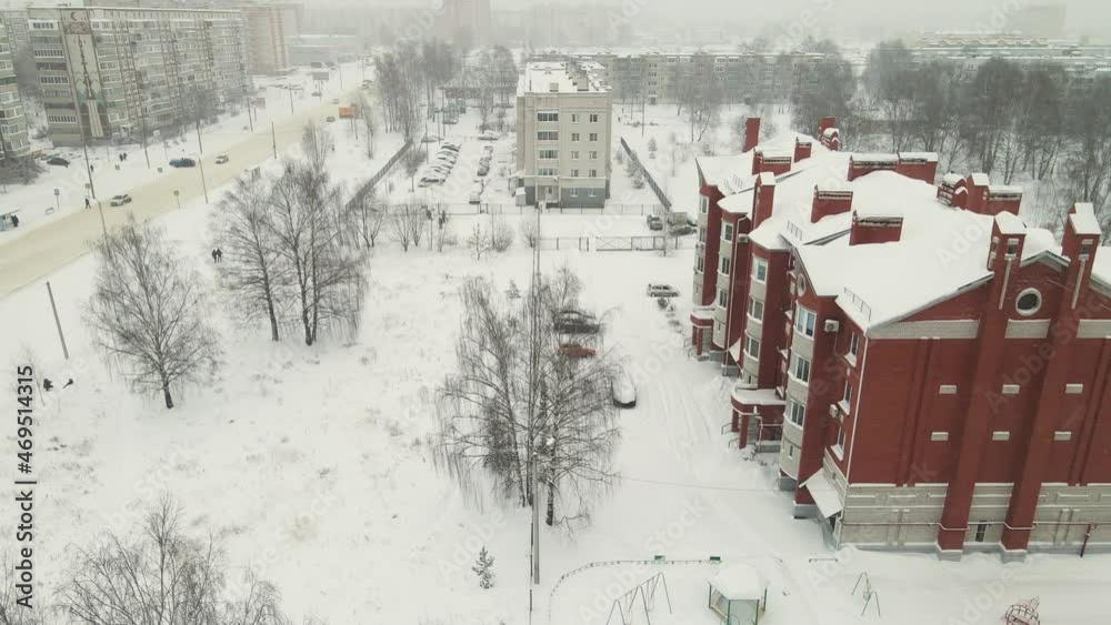 Modern apartment buildings covered with snow after a blizzard. Aerial ...