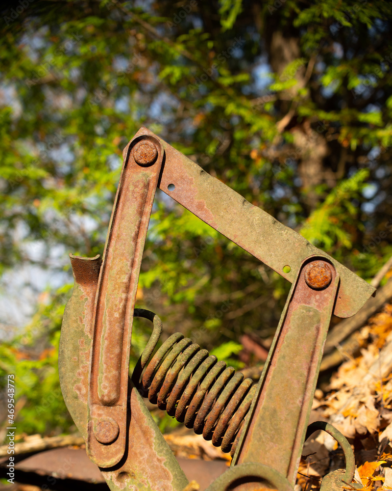 rusty parts of old car in auto junkyard metal spring rust colored ...