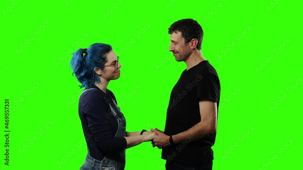 Happy Romantic Couple Hold Hands Kissing On Green Screen. Happy couple ...
