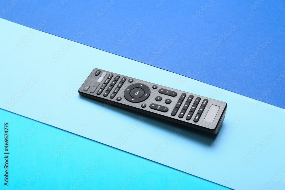Modern TV remote control on color background Stock Photo | Adobe Stock