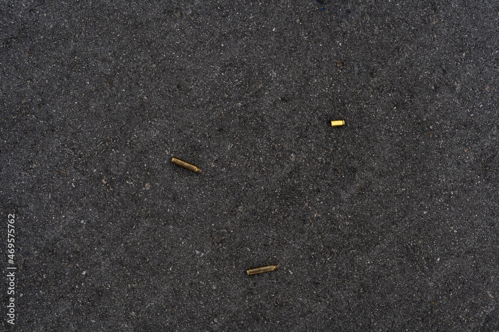 Two different caliber bullet shell casings on asphalt street Stock ...