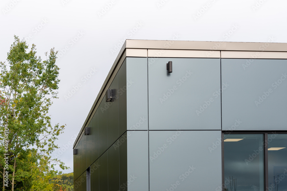The exterior wall of a contemporary commercial style building with ...