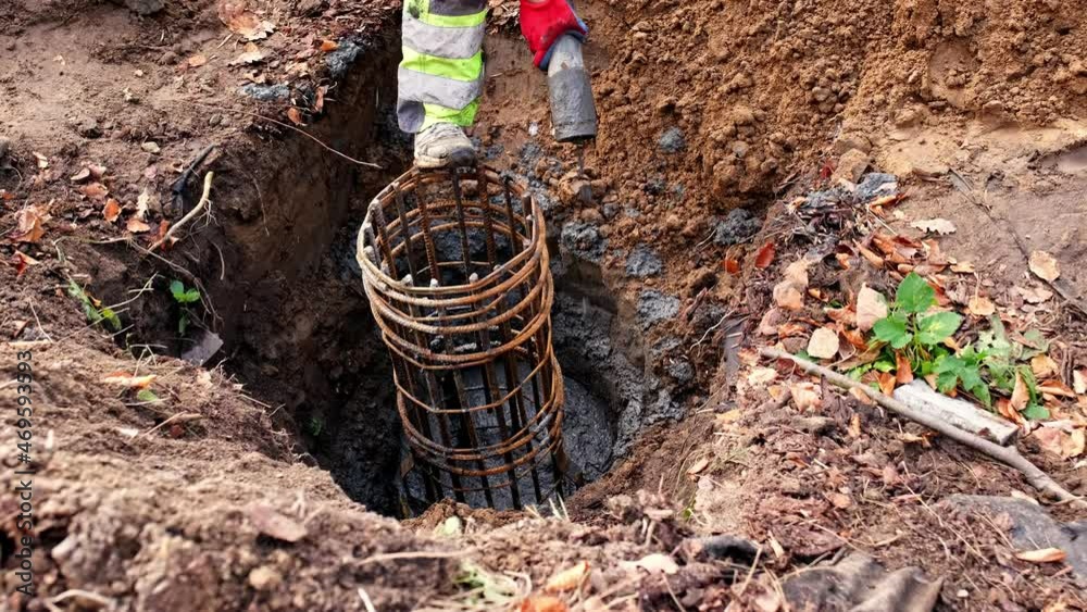 Construction Worker Pouring Liquid Cement From Pipeline Filling Up ...