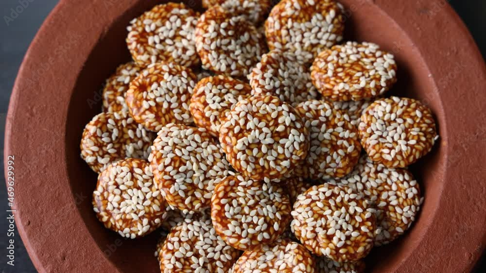 Revdi revri til gud revdi rewari sesame cookie woman hand serving ...