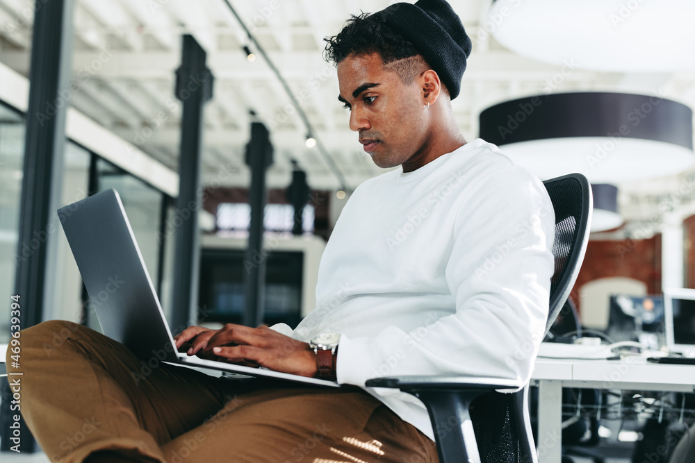 Software developer working on a new project in an office Stock Photo ...