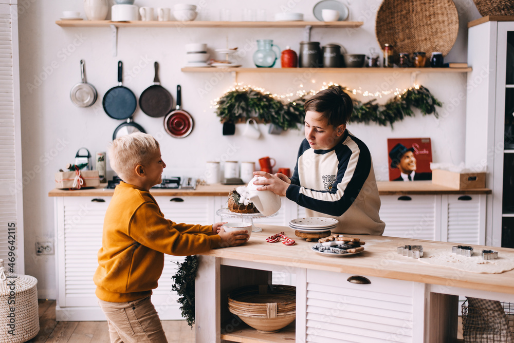 two boys in the kitchen are cooking Stock-Foto | Adobe Stock