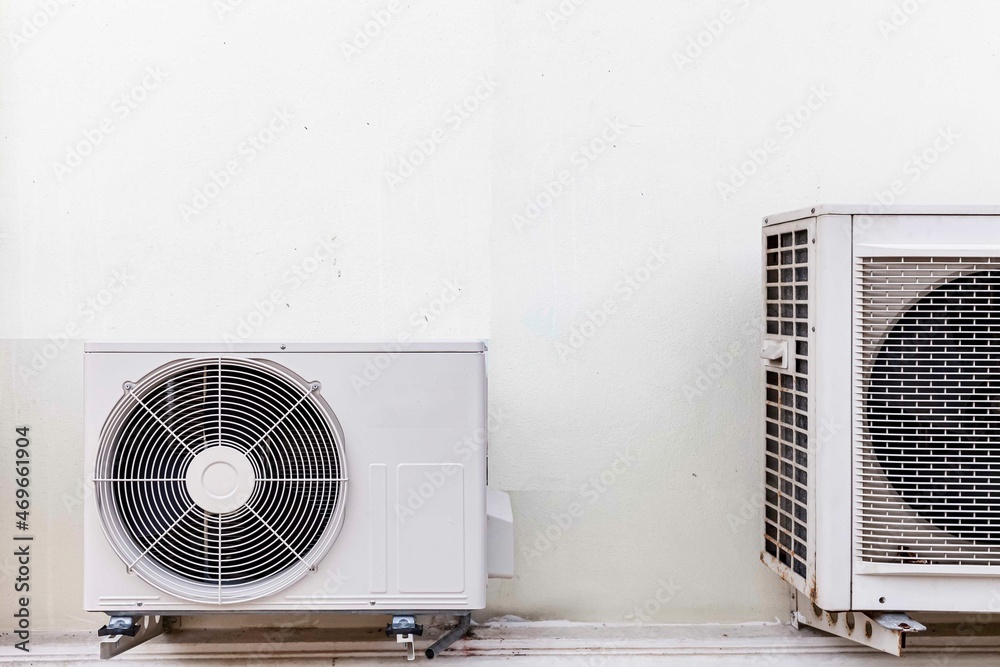 Air conditioner compressor outdoor unit installed outside the building ...