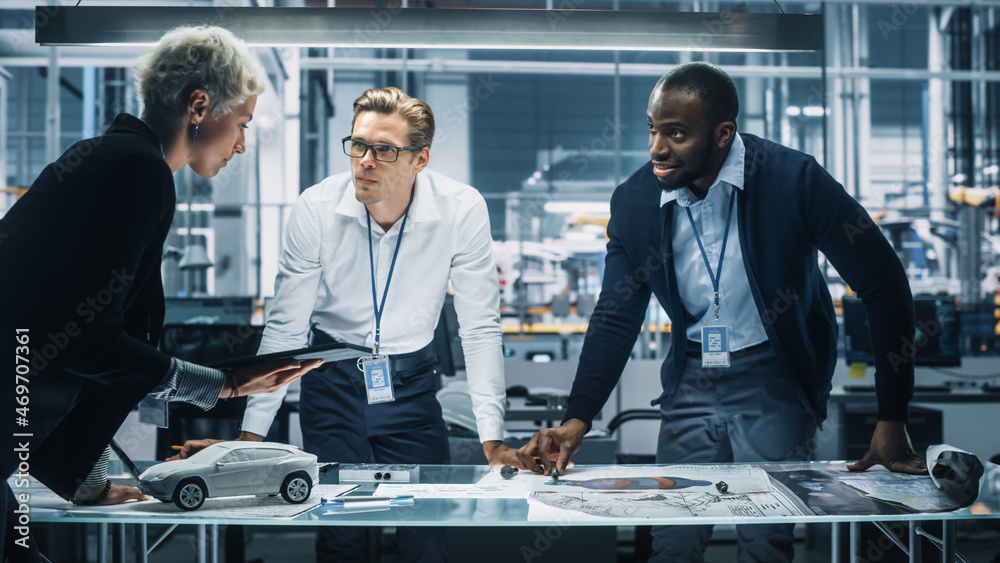 Young Diverse Team of Automotive Engineers Working in Office at Car ...