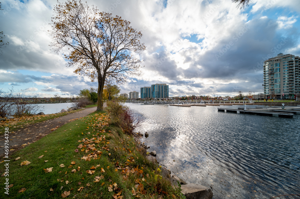 Barrie waterfront centennial park lake shore path with green grass and ...