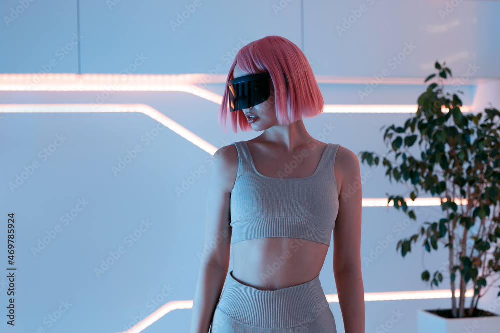 Woman in futuristic costume. Female in modern VR glasses interacting ...