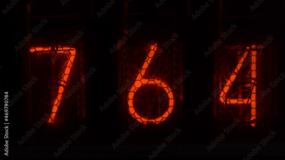 Retro vacuum tube display on the device counts seconds. Displaying ...