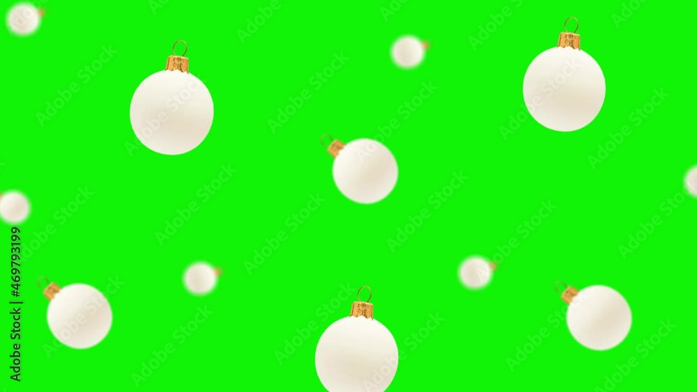 Flying Blank white christmas ball of different diameters on the green ... Flying Blank white christmas ball of different diameters on the green ...