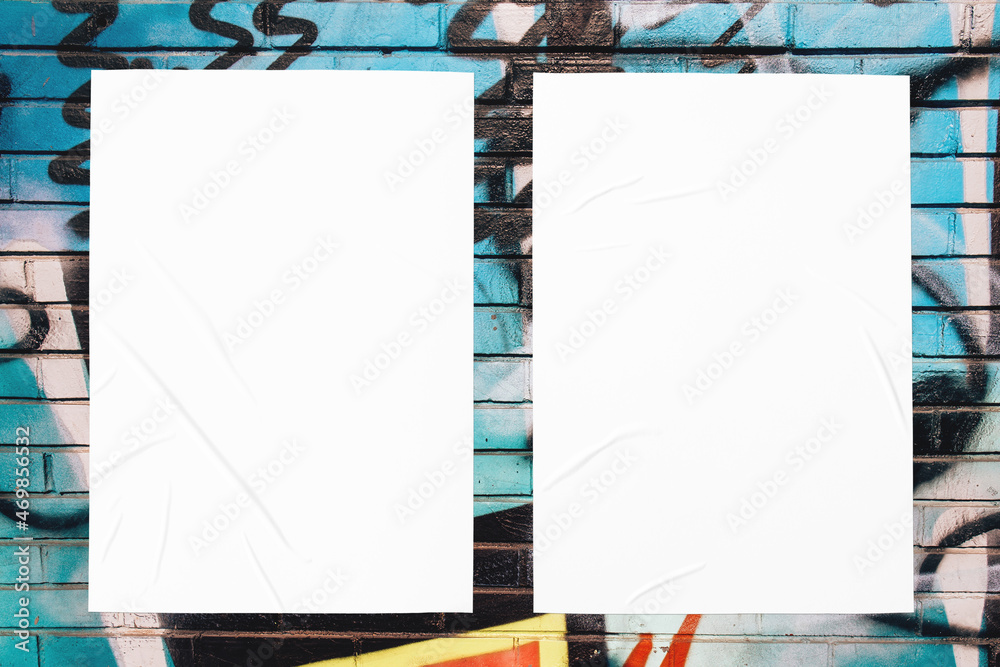 Closeup of colorful messy painted urban wall texture with two wrinkled ...