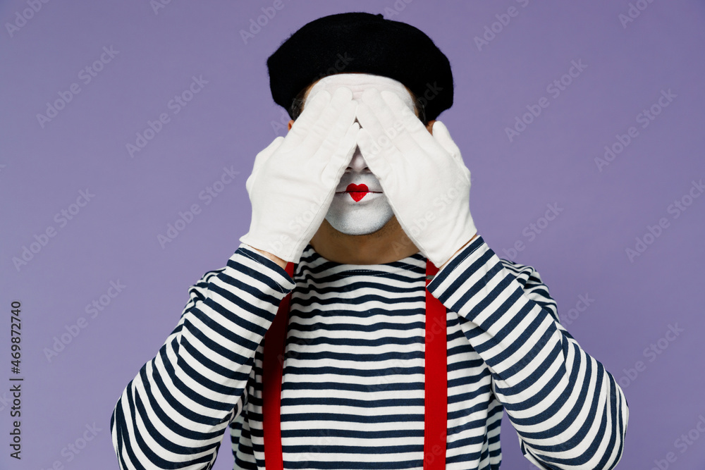 Strict concerned young mime man with white face mask wears striped ...