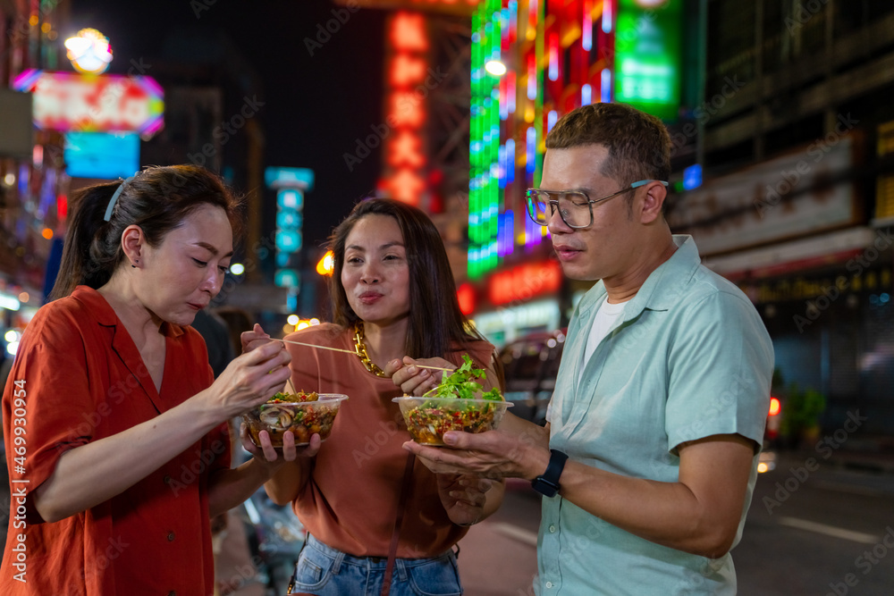 Group of Asian woman and LGBTQ people friends tourist enjoy eating ...