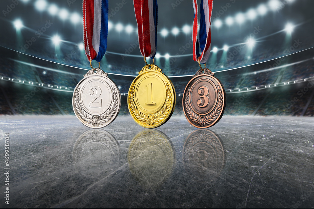 real Gold, silver and bronze medals in the large, illuminated winter ...