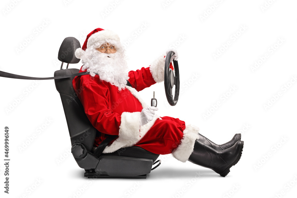 Santa Claus in a car seat holding a steering wheel and a key Stock ...