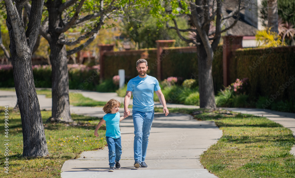 cheerful dad with kid relax together in park, family walk Stock Photo ...