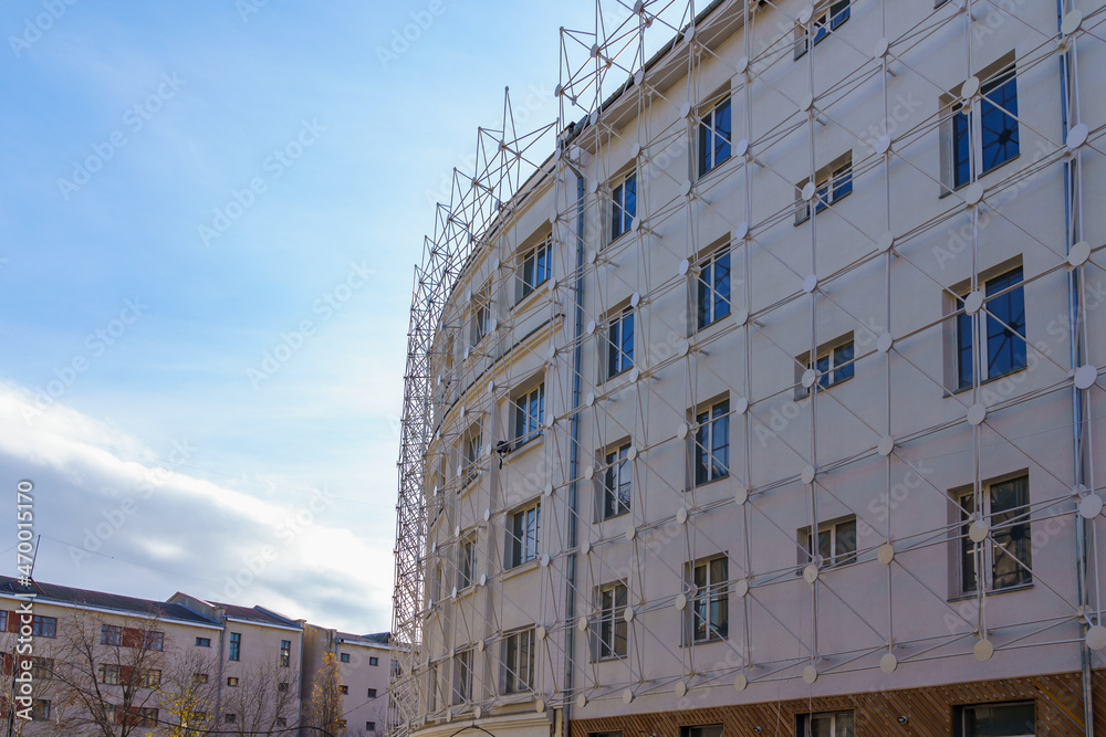 Scaffolding on the facade of a typical building during reconstruction ...