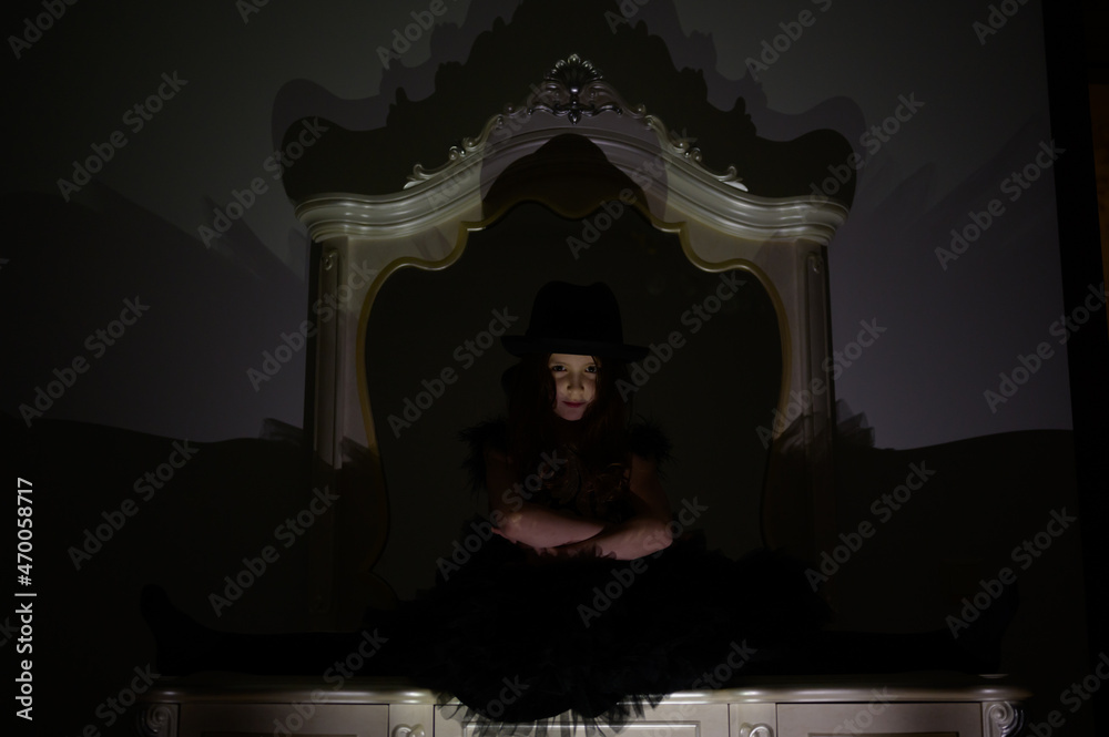 horror movie concept of funny scary little girl in Halloween black hat ...
