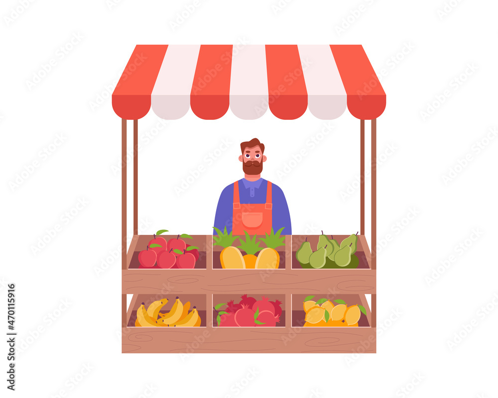 Man standing at counter of greengrocer's shop or marketplace and ...