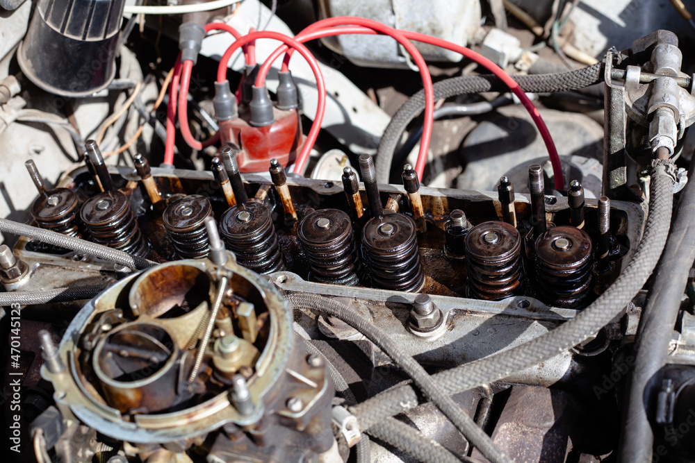 Disassembled carburetor motor. Cylinder head without rocker shaft ...