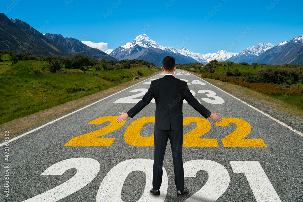 The 2022 New Year journey and future vision concept . Businessman ...