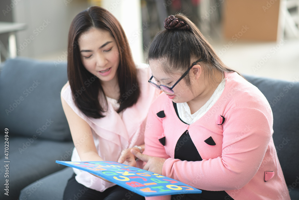 Autistic girl. Mother is training the development of autistic daughter ...