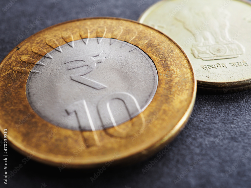 Two Indian coins. 10 rupee coin with the symbol of national currency ...