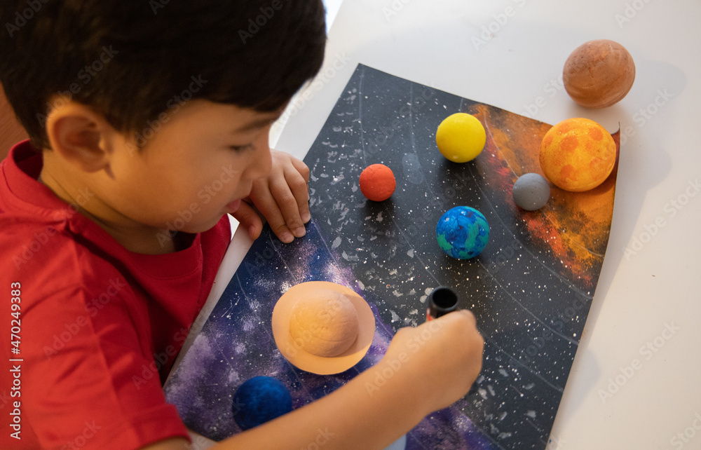 Preschooler glue a 3D planets on list of paper. Homeschool education ...
