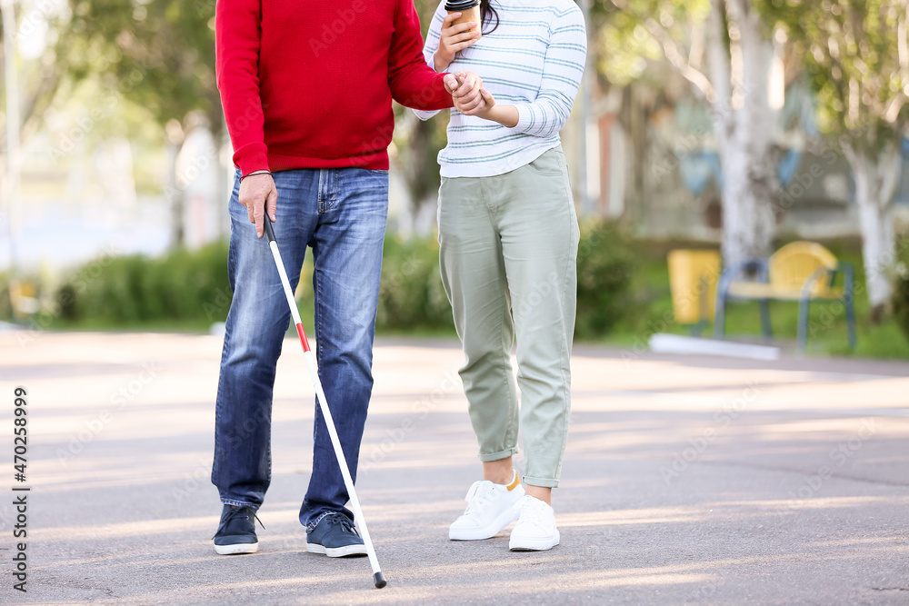 Blind man with his daughter walking outdoors Stock Photo | Adobe Stock