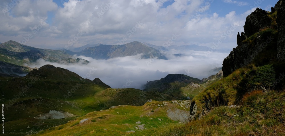 Beautiful mountain view above clouds during hiking on peak Djeravica ...
