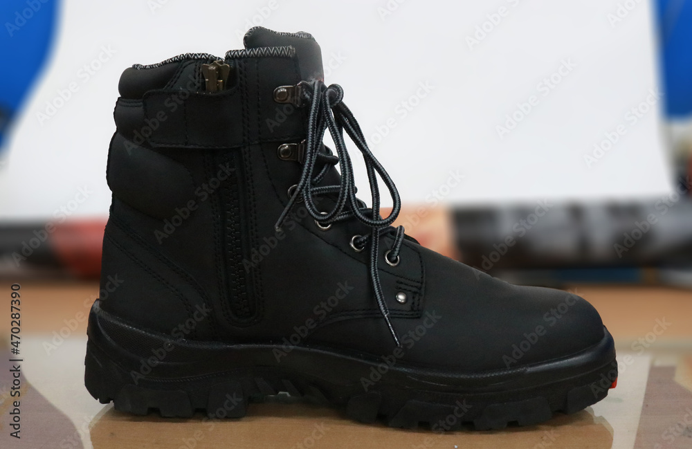 black boots for daily activities and protect the feet. Workers also ...
