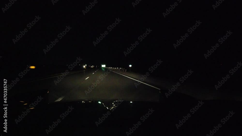 Highway Driving At Night Red Sports Car With Traffic Signs And Turnoff ...