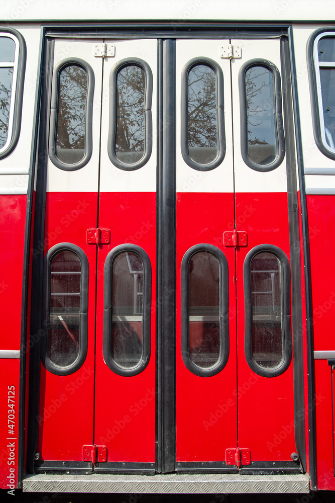 Bus doors. Close-up of red sliding doors of an old passenger bus. Retro ...