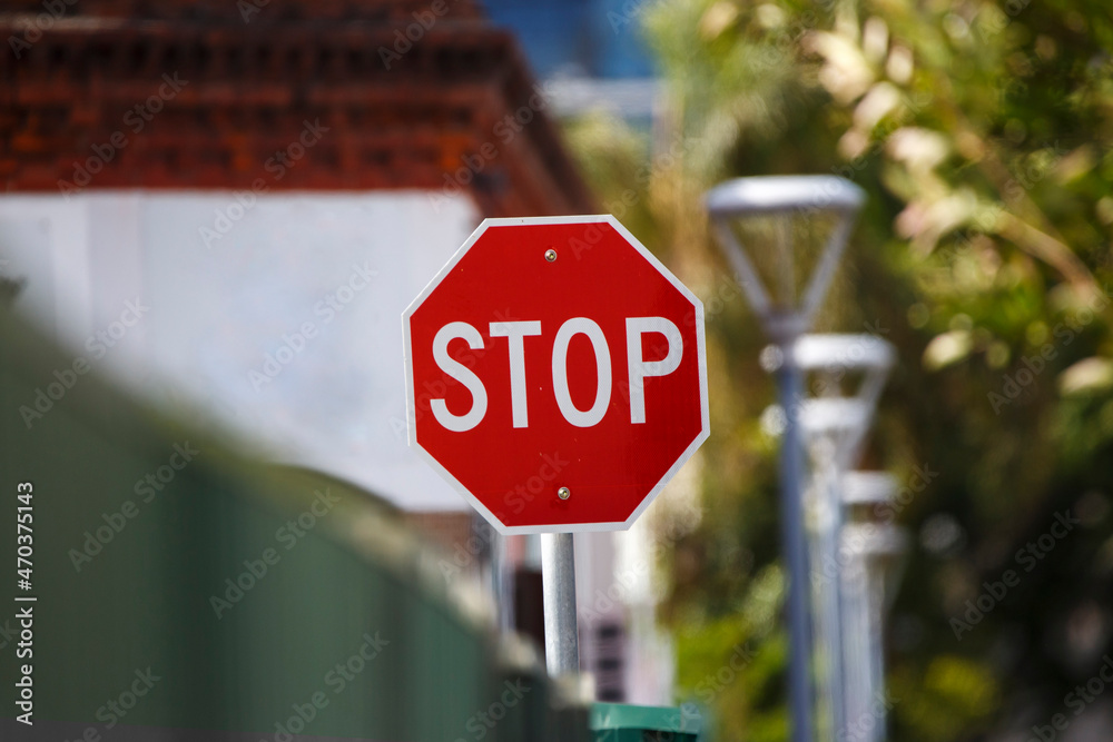 big red stop sign in the corner of a street in South Australia Stock ...