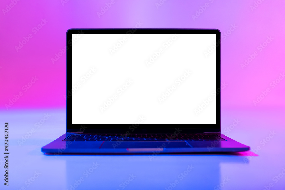 Laptop computer with blank white screen in neon light, mockup for ...