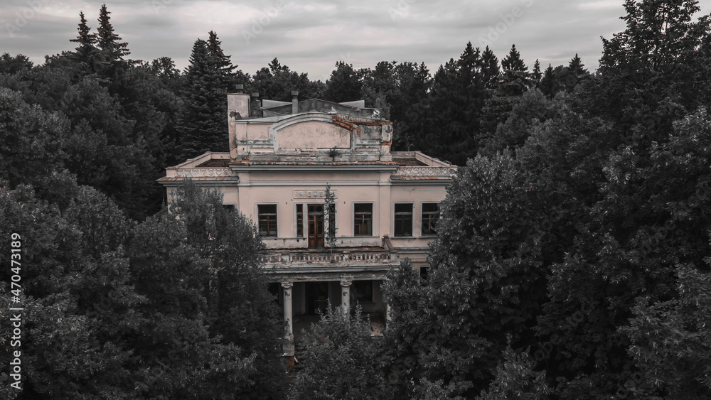 Old beautiful mansion in the forest. House with white walls. The ...