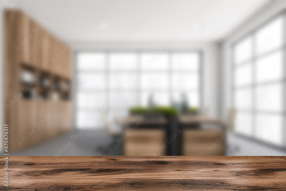 Wooden table for product display with blurred workplaces on background ...